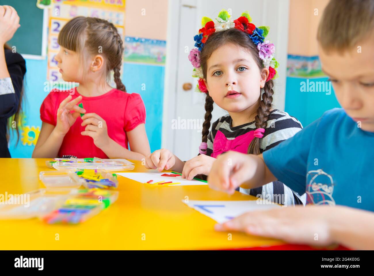 Cute little children on lesson at kindergarten Stock Photo - Alamy