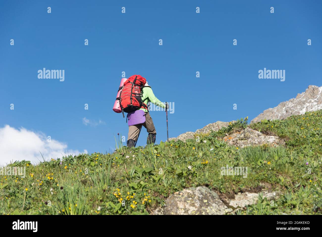 Idyllic winter landscape with hiking man in the mountains. Rocks, snow ...