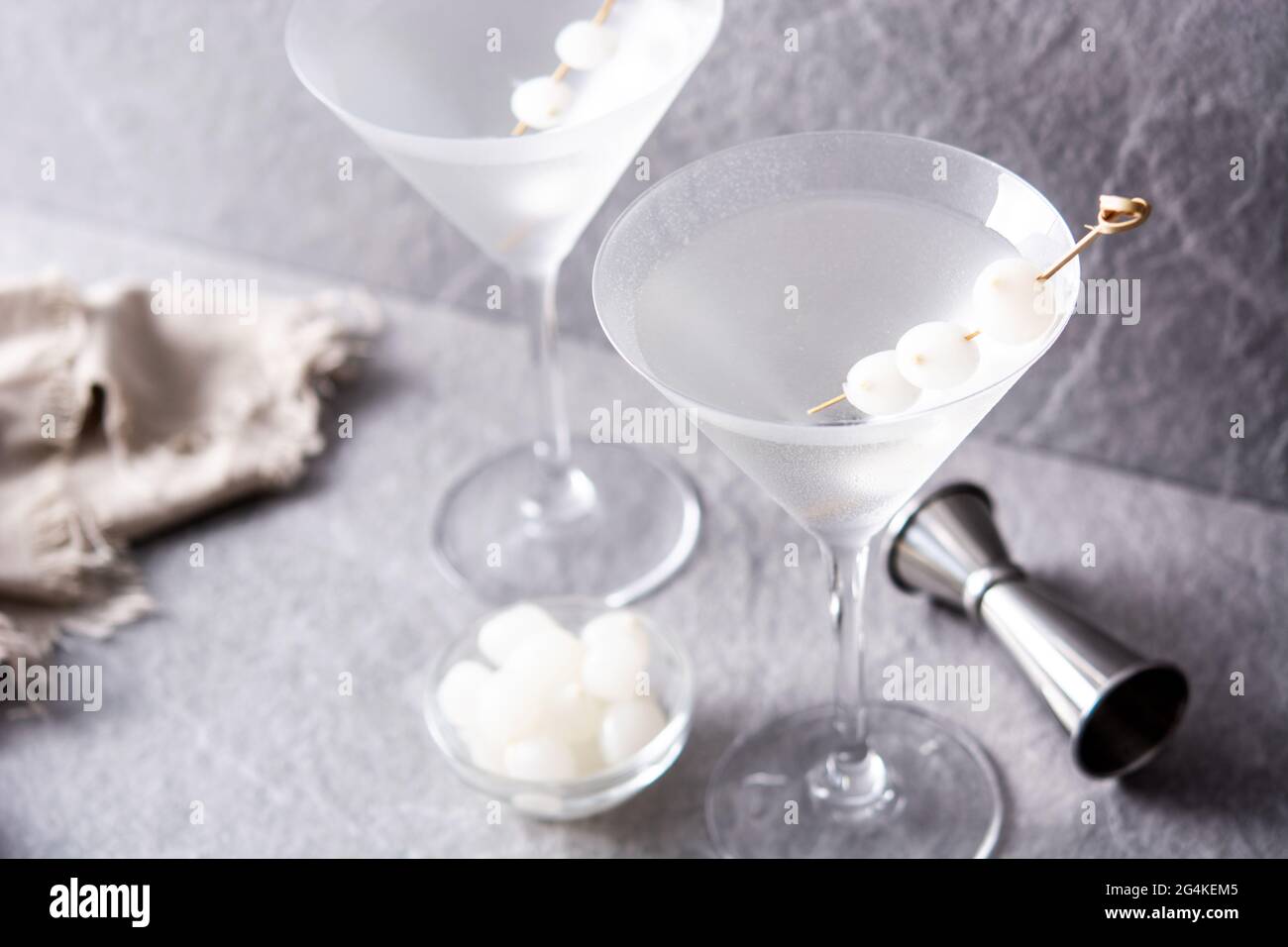 Gibson martini cocktail with onions on gray stone Stock Photo - Alamy