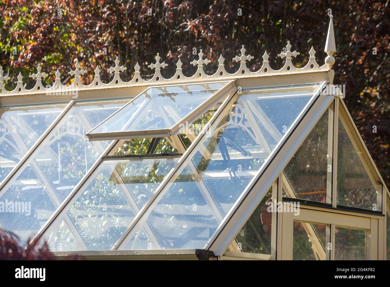 Greenhouse in back garden with open windows for ventilation Stock Photo ...