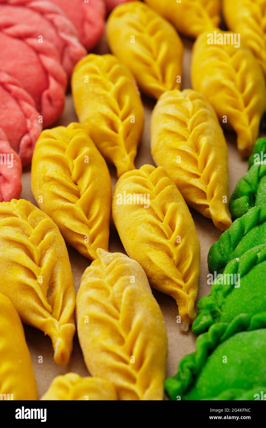 Dumplings made by hand in different green, yellow, red colors Stock ...