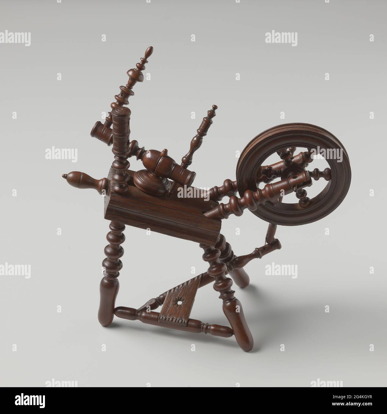 Spinning wheel, miniature, with twisted bars. Spinning wheel in ...