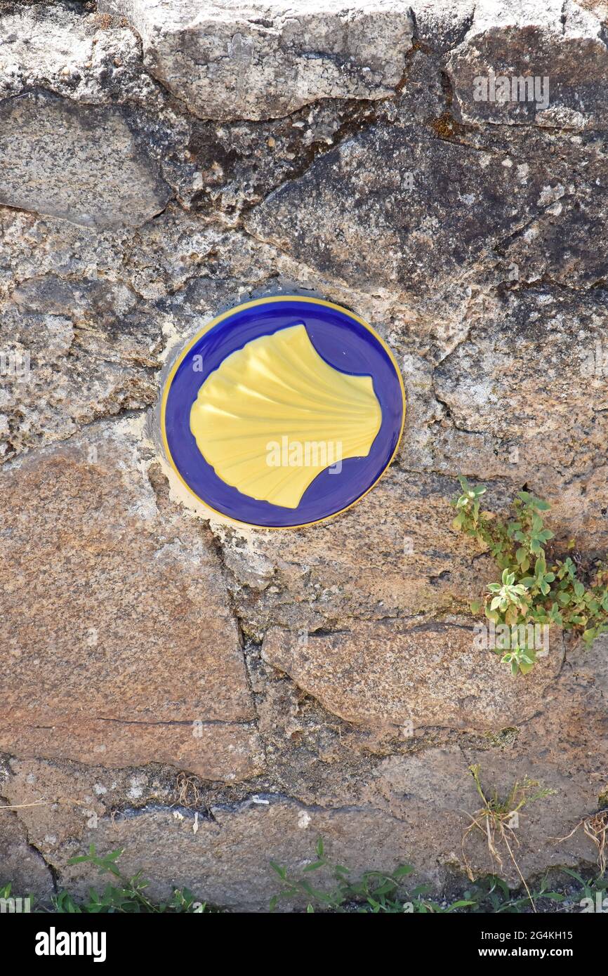 A ceramic scallop shell let into the medieval stonework of the Pont ...