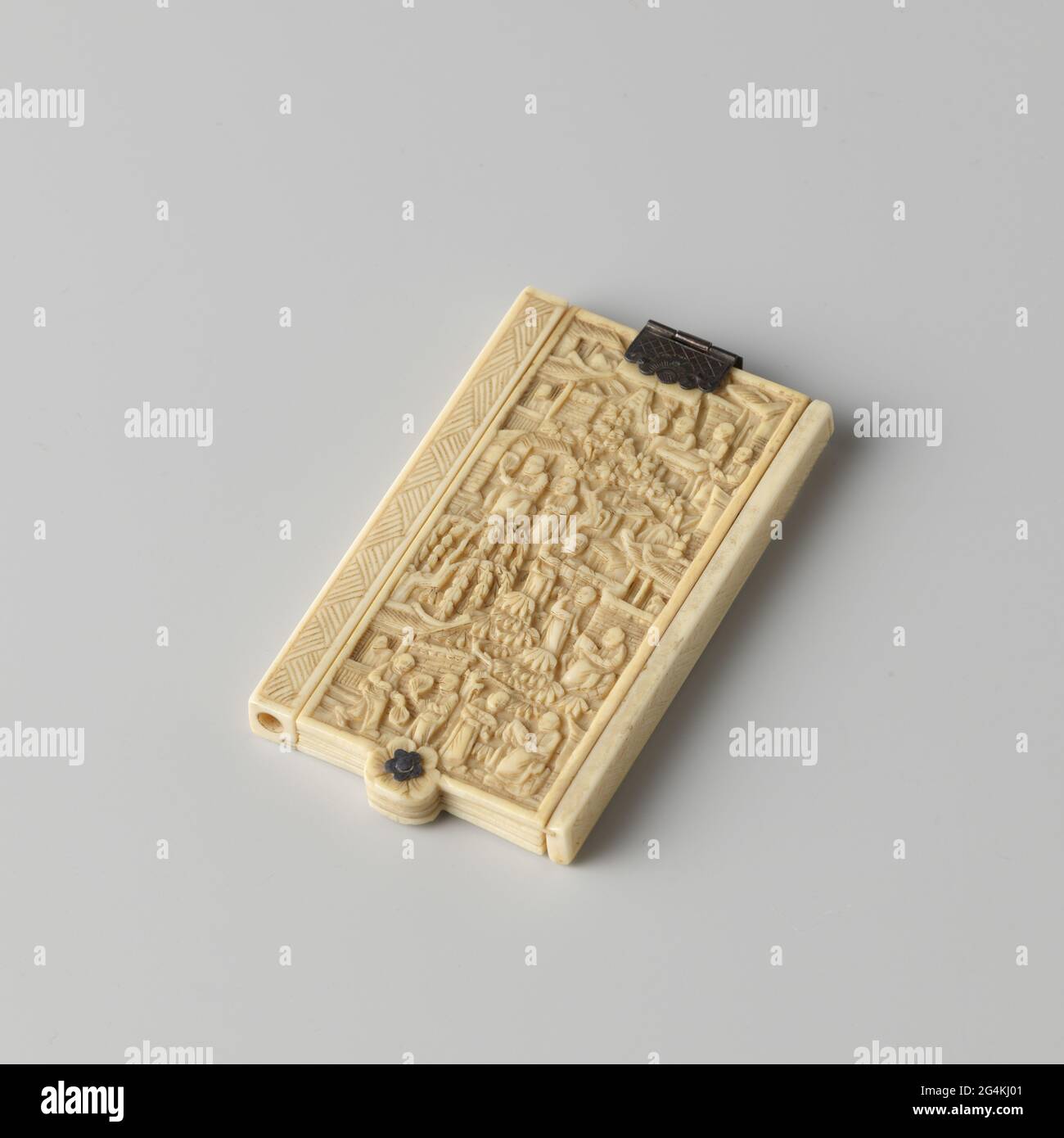 Ivory notebook with five sheets, a sliced tire and silver clasp ...