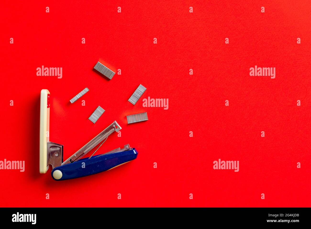 simple stapler and staples isolated on the colorful background in ...