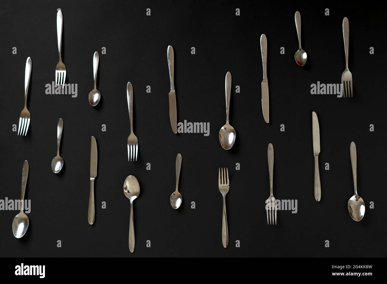 classic set of steel cutlery flat lay on the colorful background ...