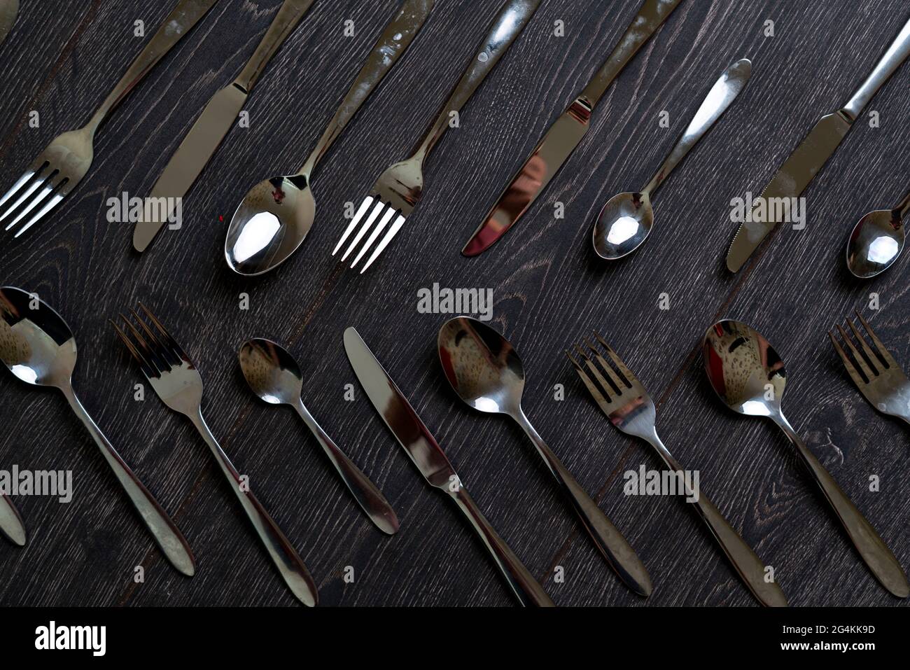 classic set of steel cutlery flat lay on the colorful background ...