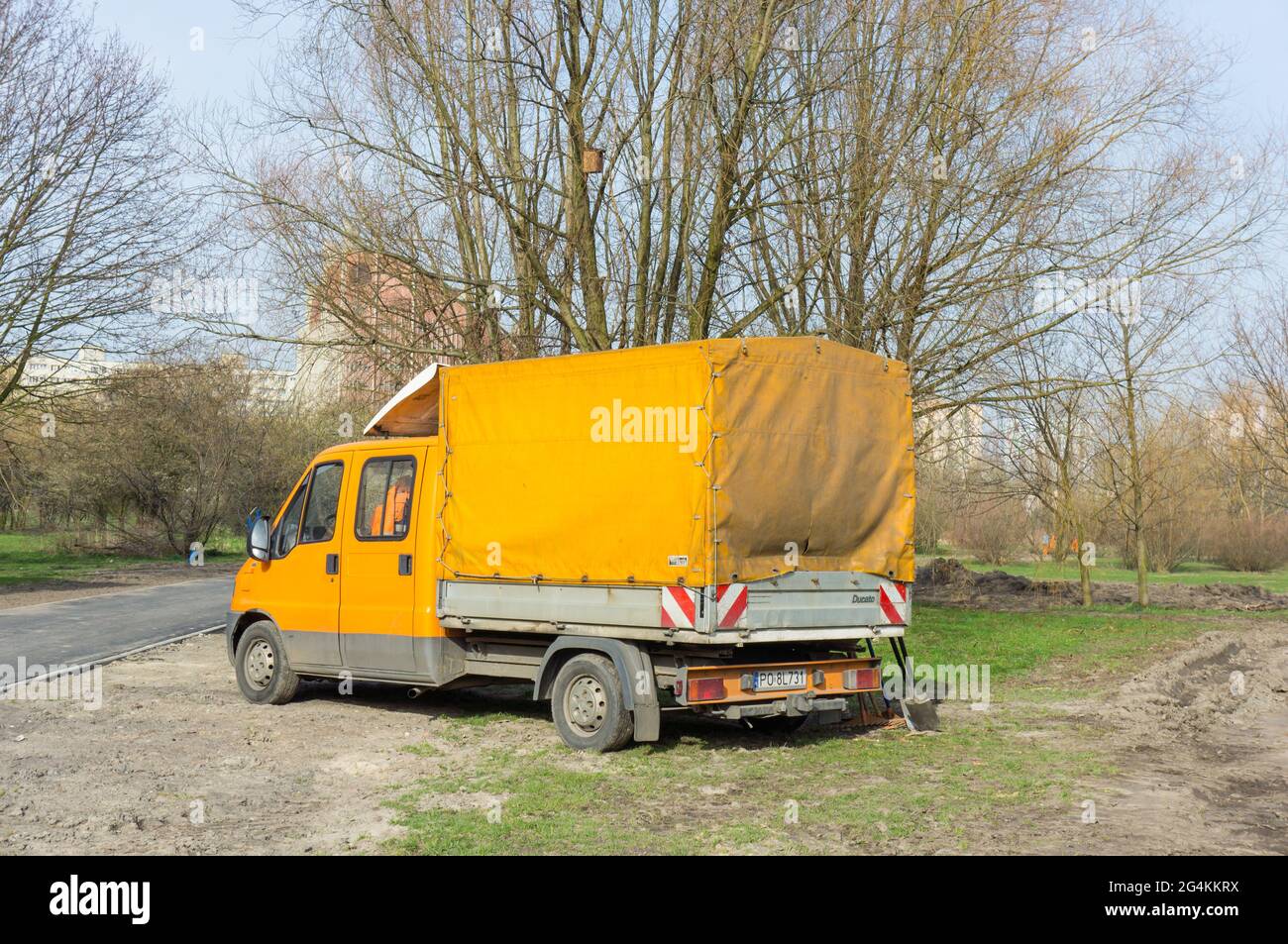 POZNAN, POLAND - Apr 04, 2016: Yellow park workers truck on the Osiedle ...