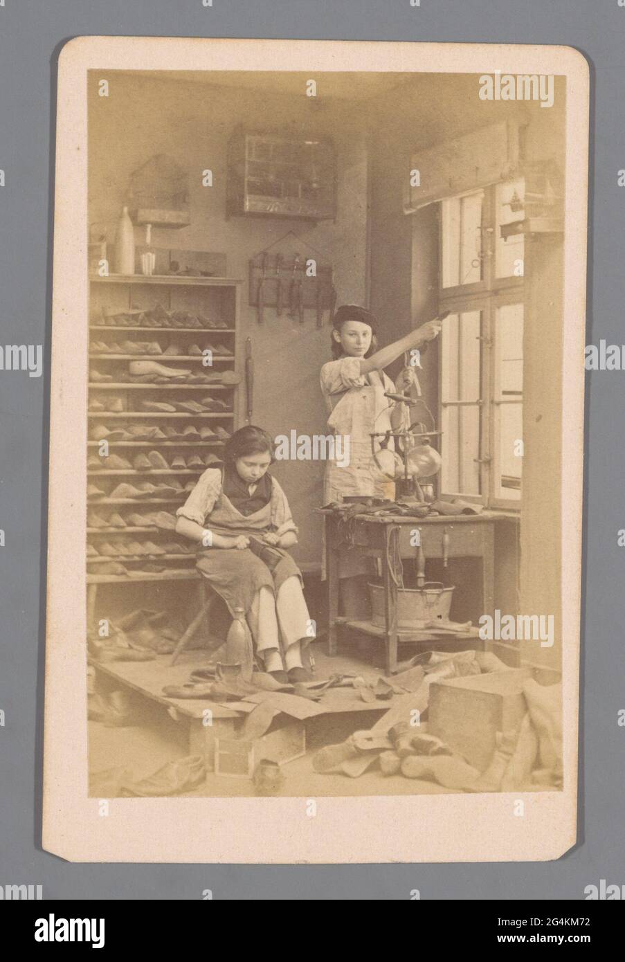 Gene proposition with two children at work in a shoemaker Stock Photo ...