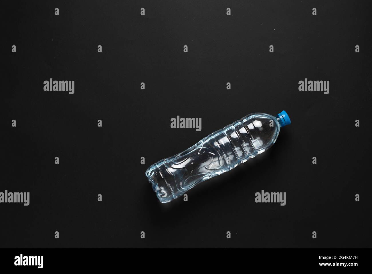 a simple plastic bottle with pure water against the colorful background ...