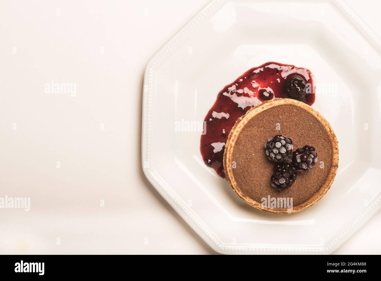 Black Forest tart. A chocolate and blackberry tart decorated with ...