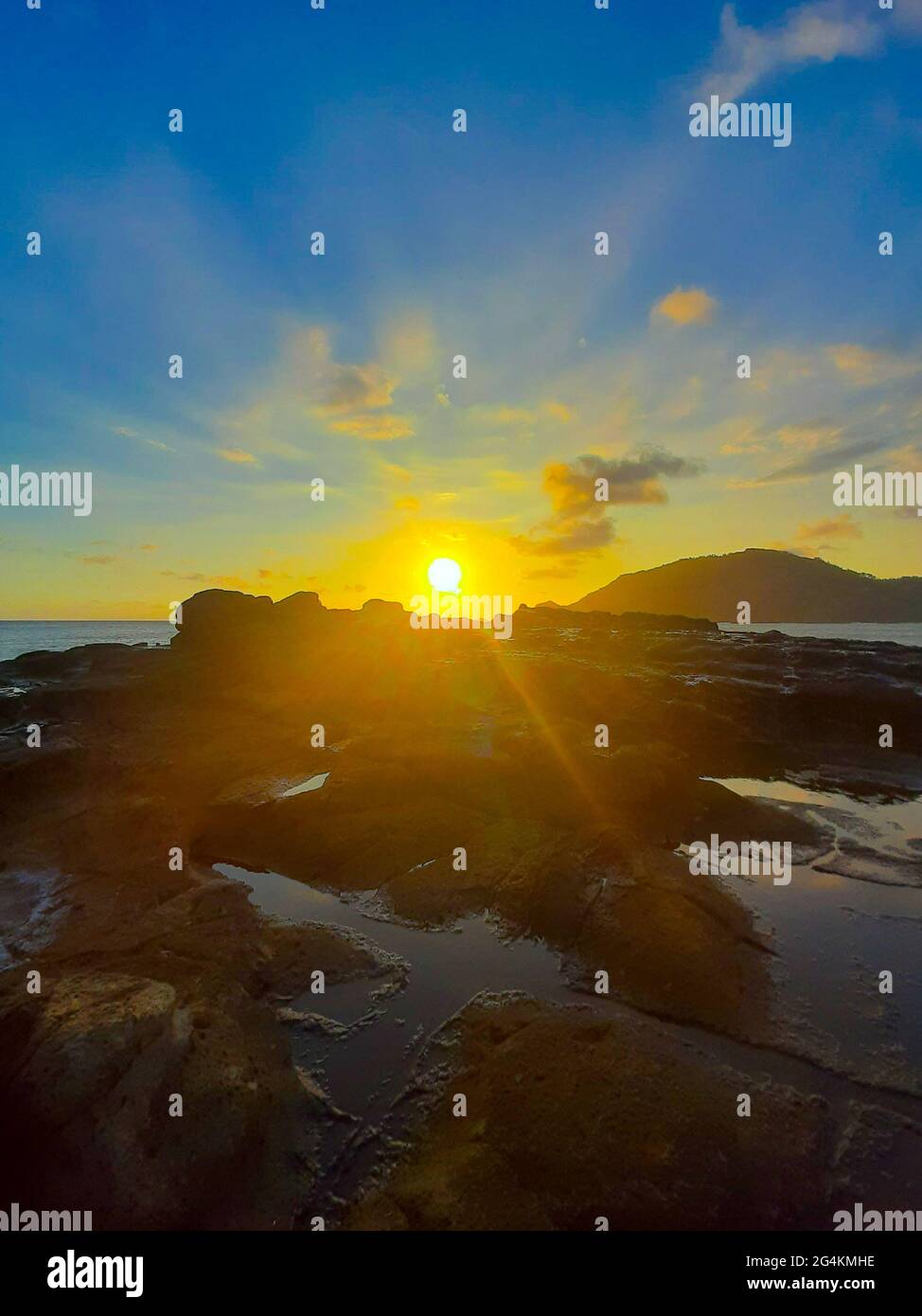 Beautiful sunbeam on extreme terrain from a rocky coast Stock Photo - Alamy