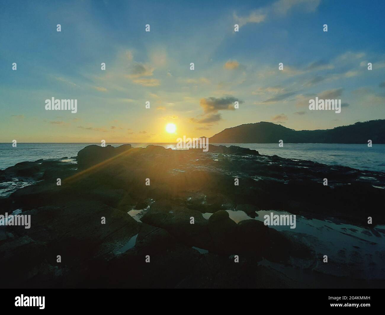 Beautiful sunbeam on extreme terrain from a rocky coast Stock Photo - Alamy