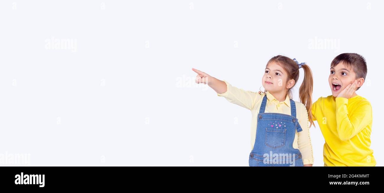 Banner, long photo. White background. Children are looking into the ...
