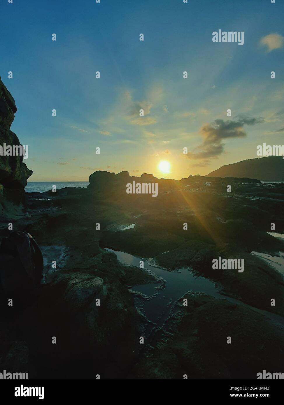 Beautiful sunbeam on extreme terrain from a rocky coast Stock Photo - Alamy