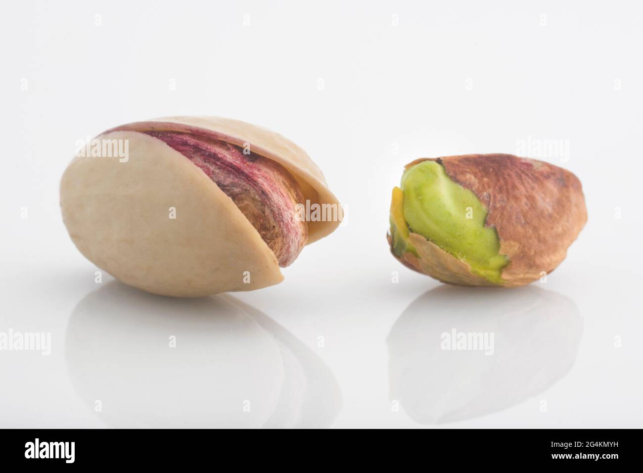 Sicilian pistachio on glossy white, Bronte, Sicily, Italy, Europe Stock ...