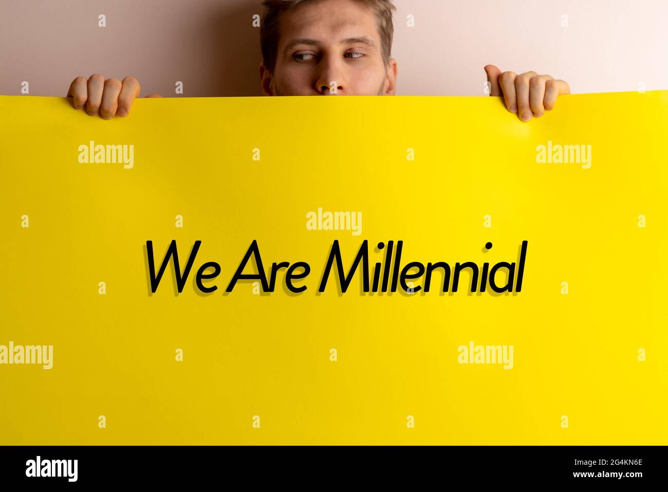 we are millenial text words on the colorful cardboard banner, new ...