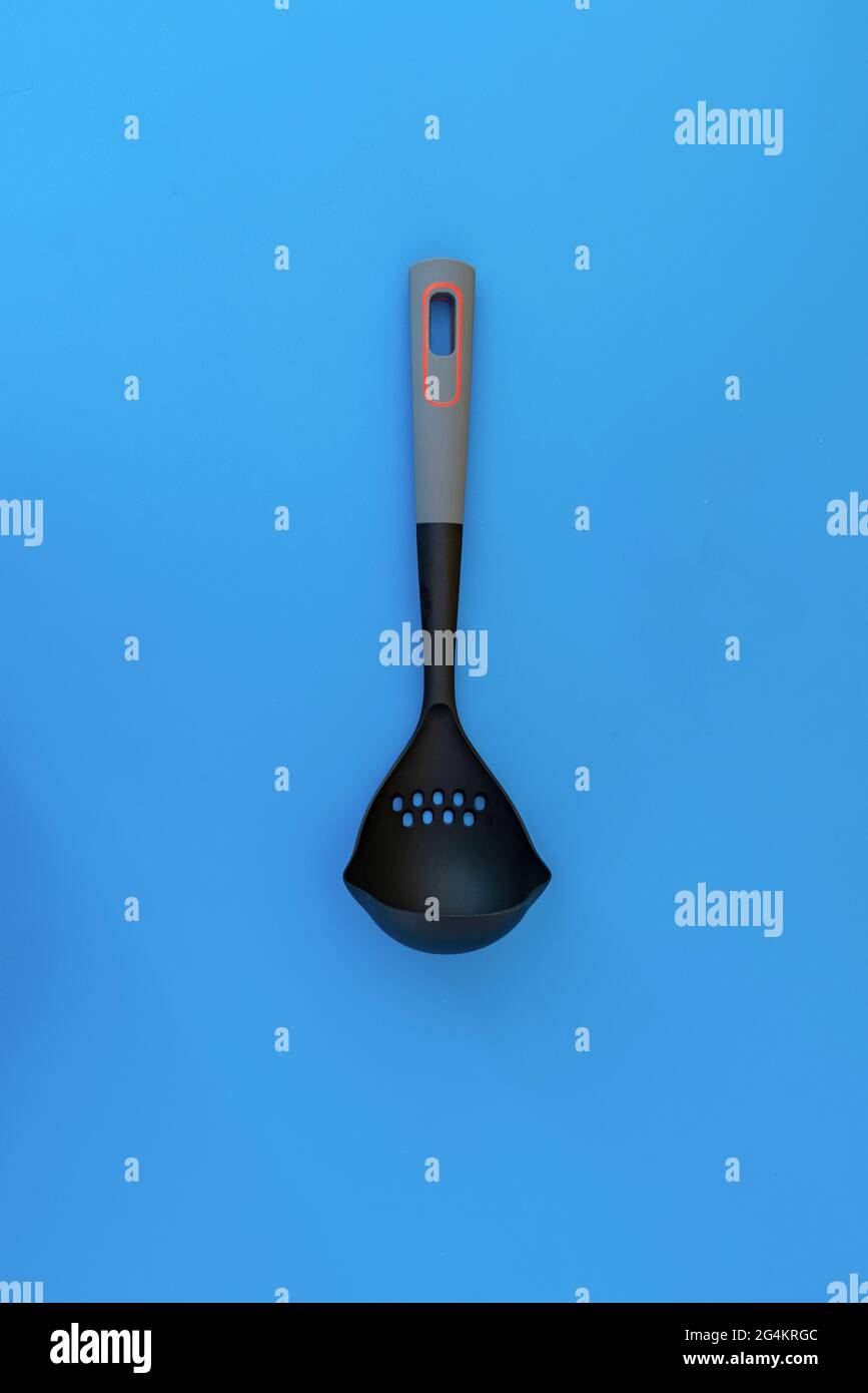 a simple cook food ladle isolated against the colorful background ...