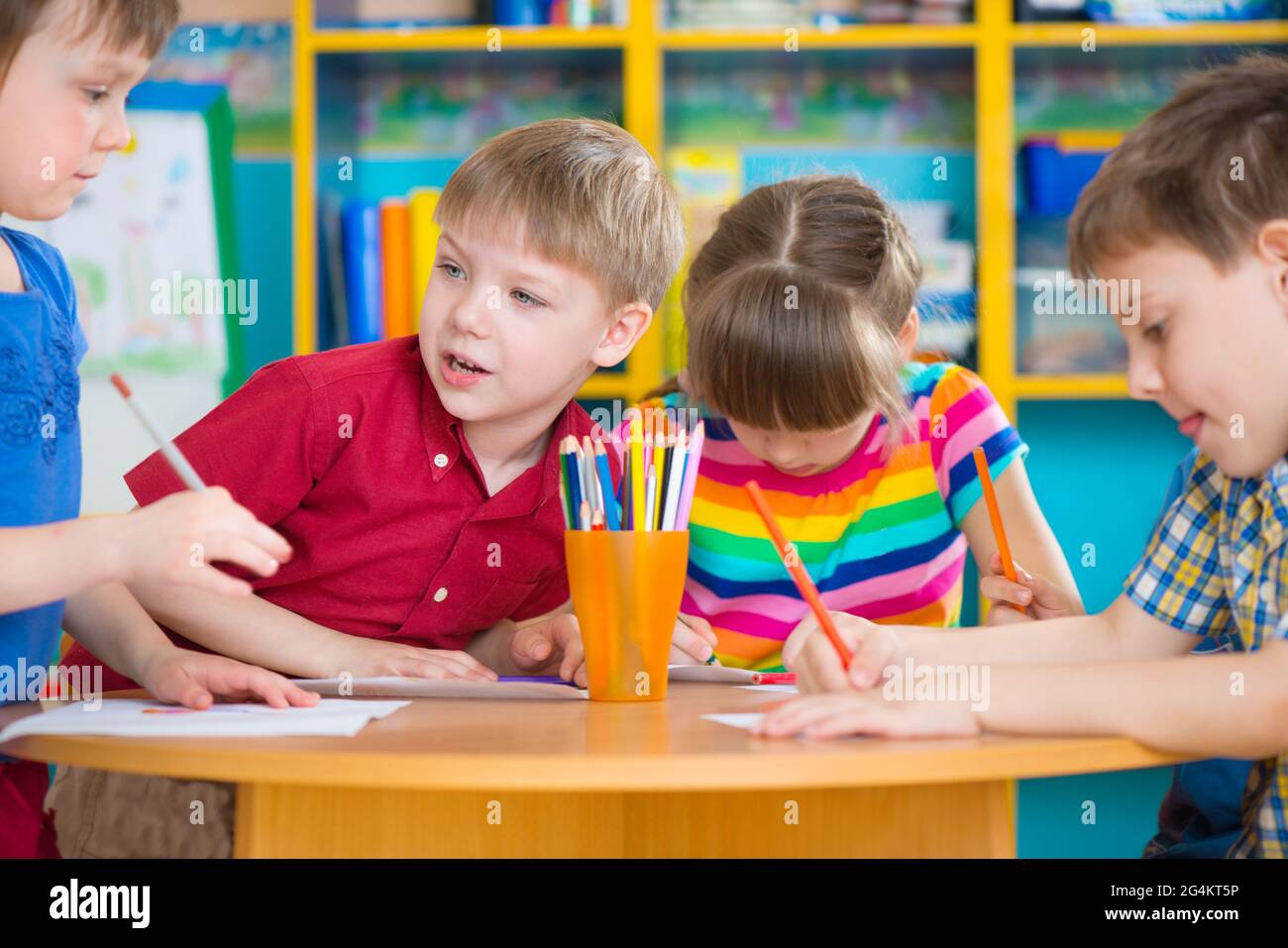 Cute little preschool children drawing with colorful paints at ...