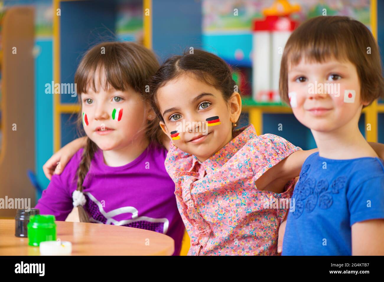 Happy children in language camp studying geography Stock Photo - Alamy