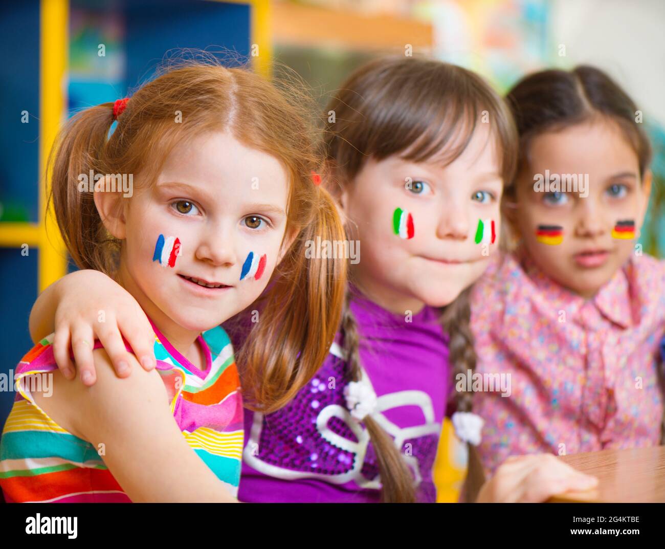 Happy children in language camp studying geography Stock Photo - Alamy