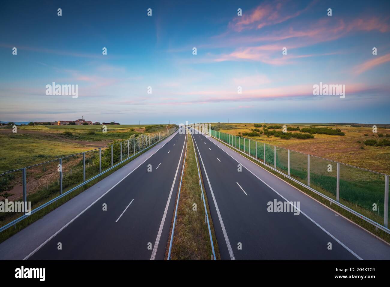 Aerial view of highway on sunset. Transportation background. Landscape ...