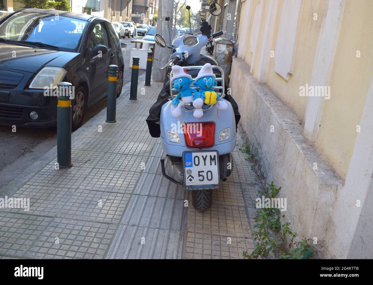 Motorbike with funny trolls on Athens street Stock Photo - Alamy