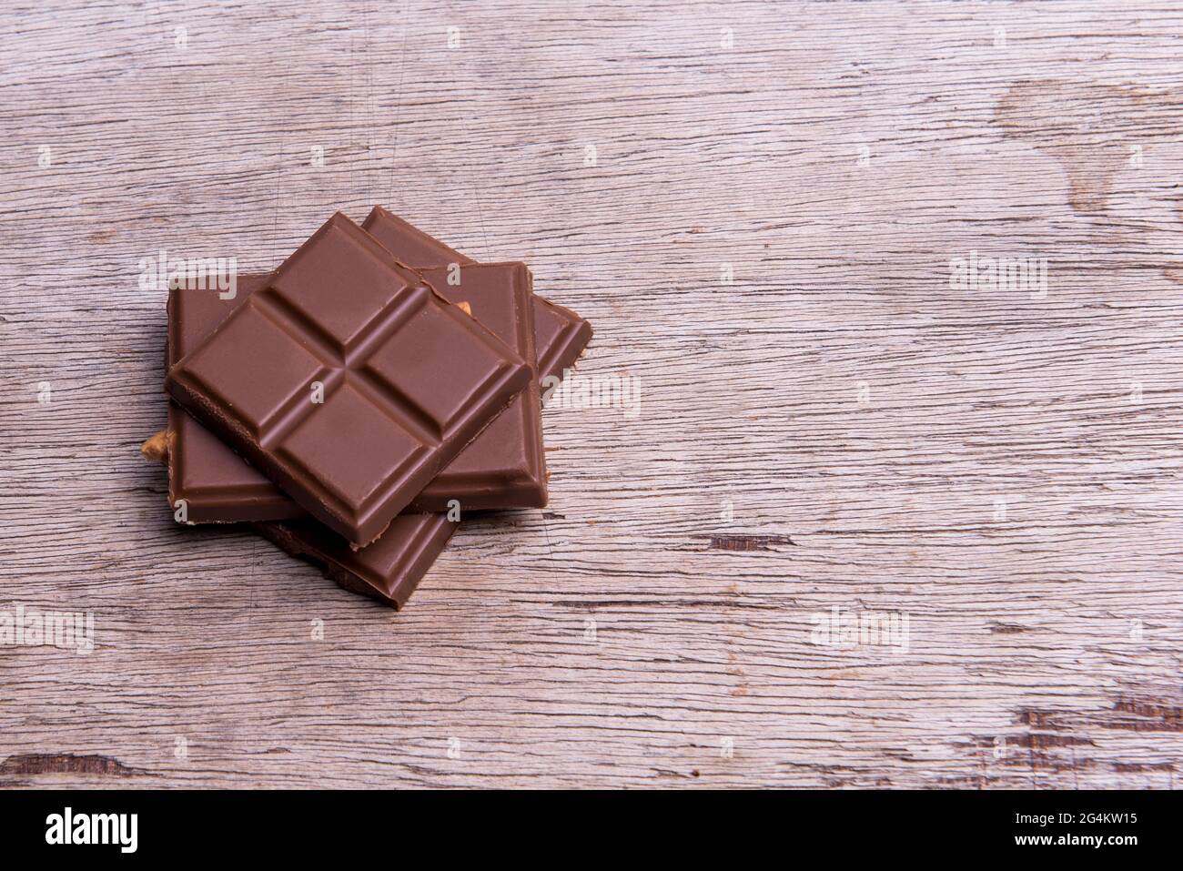 Piece of chocolate on the table Stock Photo - Alamy