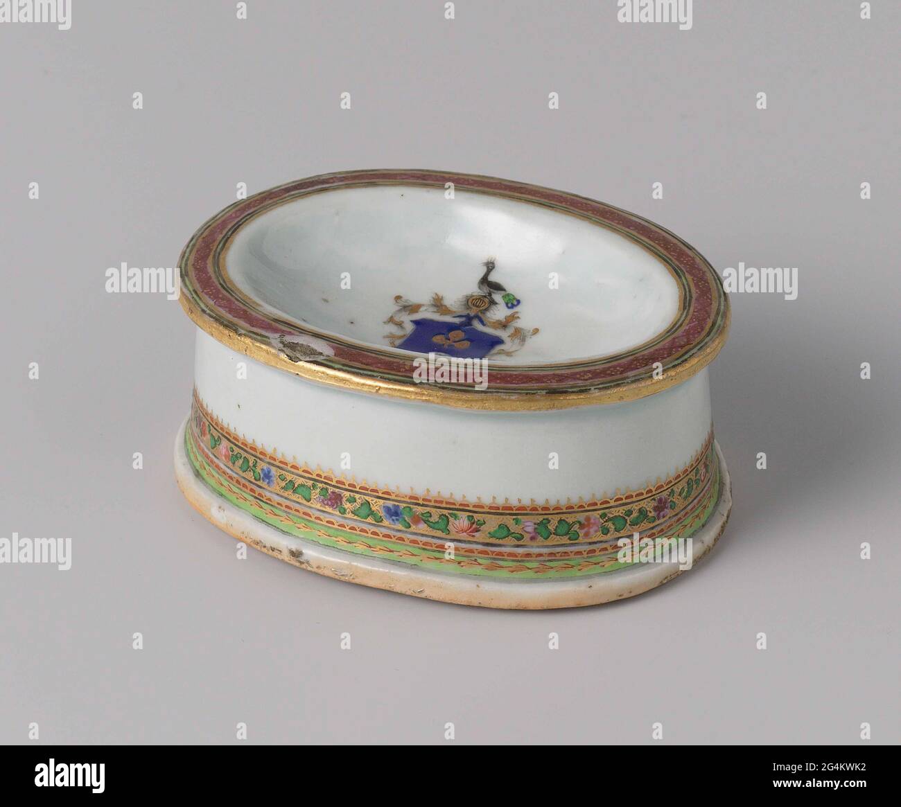 . Oval salt barrel of porcelain, painted on the glaze in blue, red ...