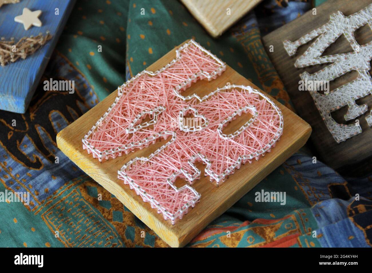 String art. Handmade board. Love Stock Photo - Alamy