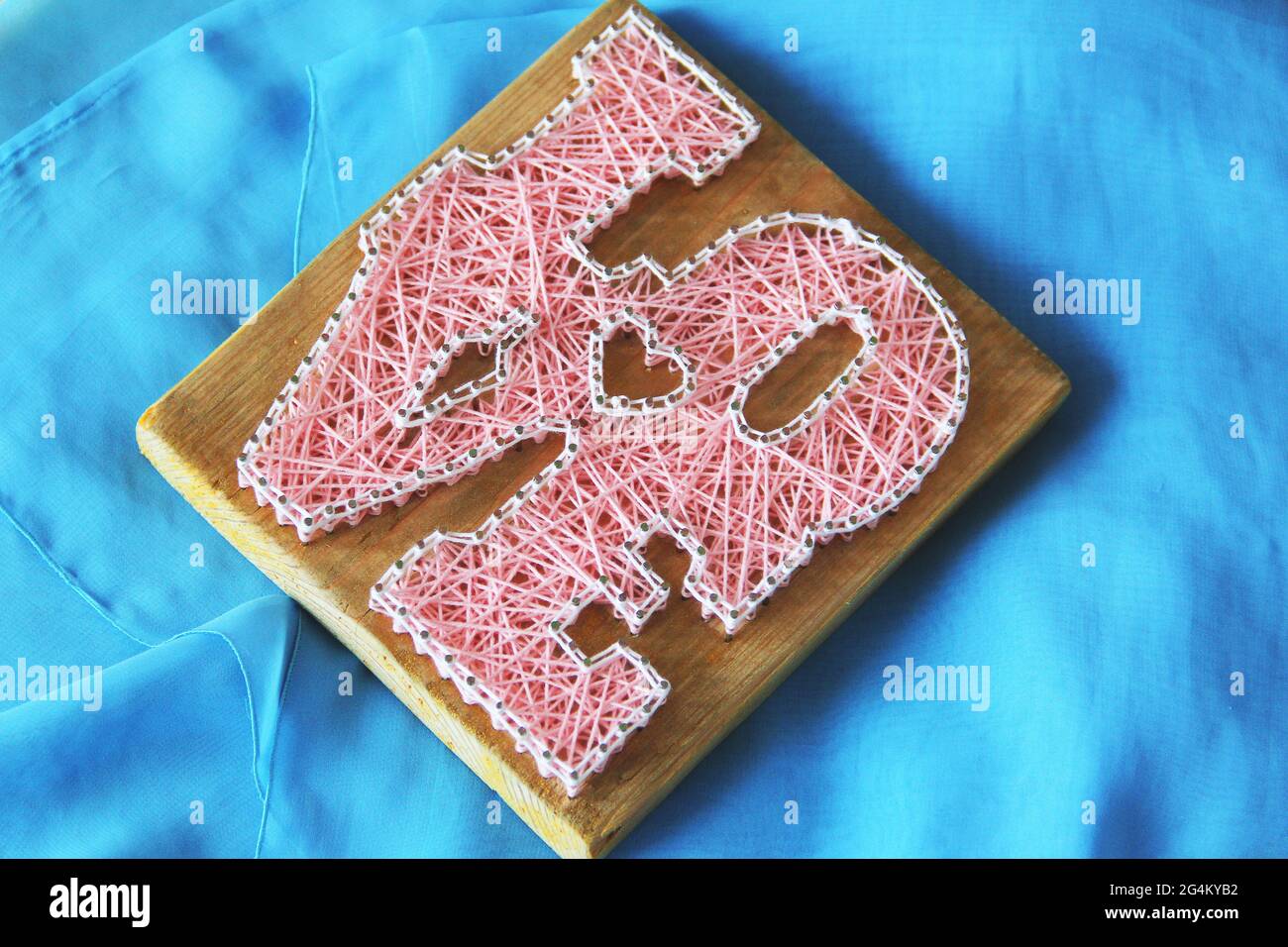 String art. Handmade board. Love Stock Photo - Alamy