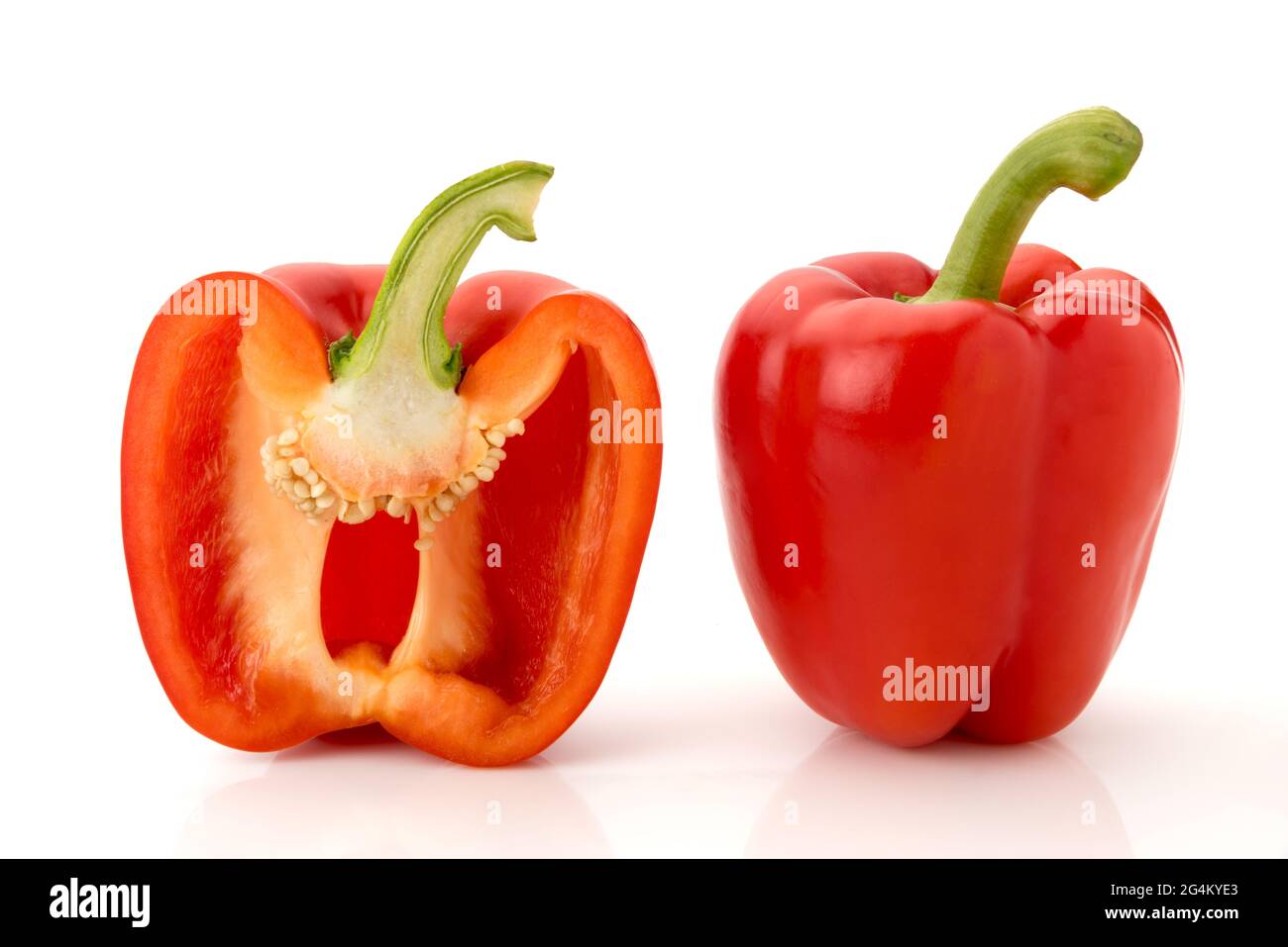one whole red bell pepper and one cut in half in cross section ...