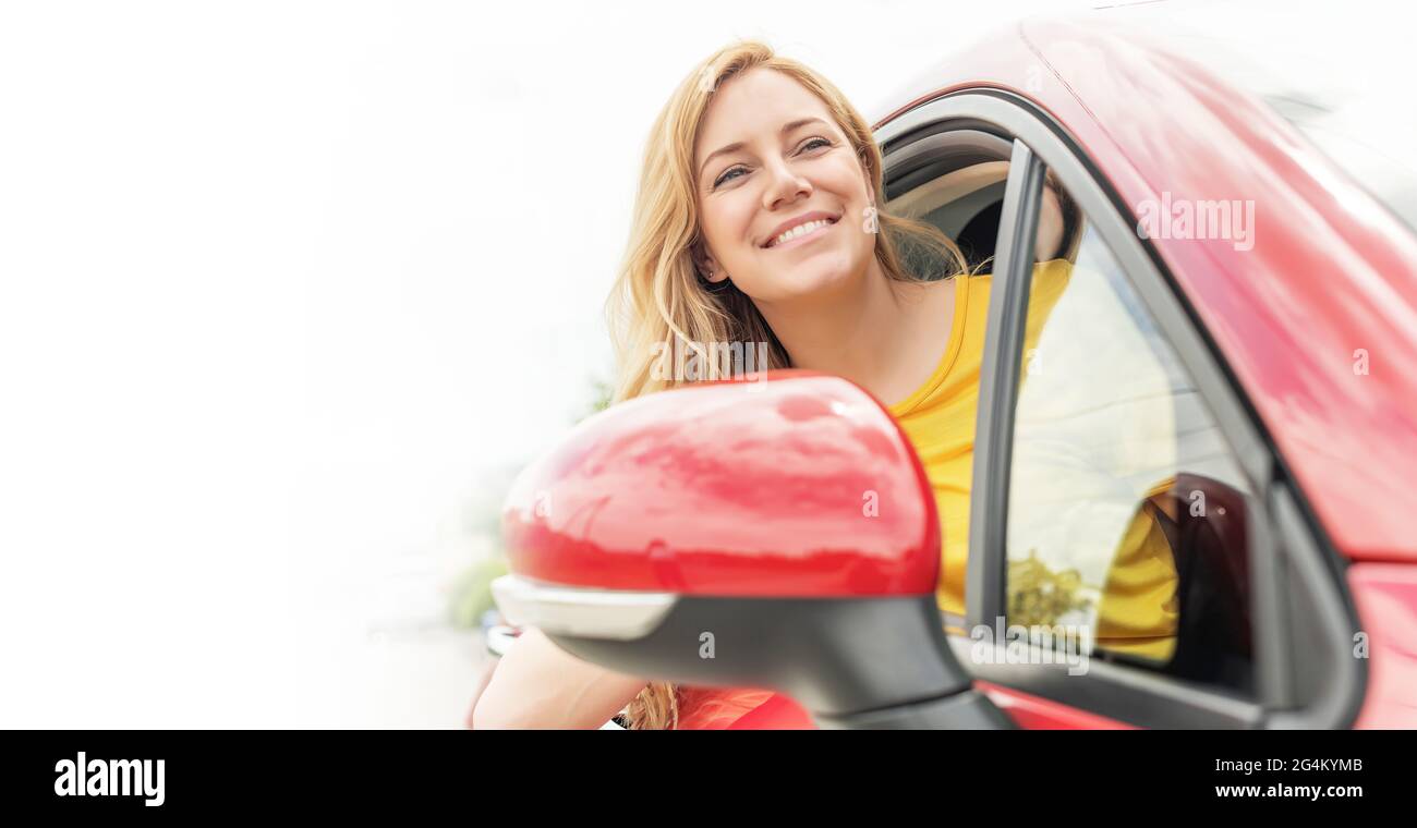 Happy beautiful woman drives a car Stock Photo - Alamy