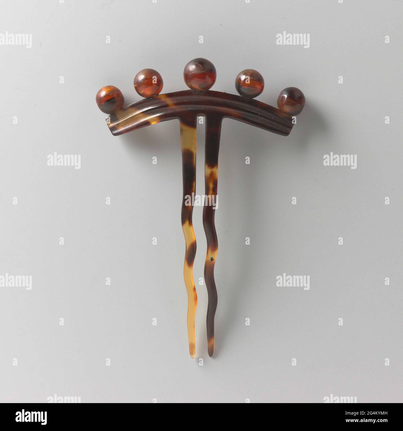 . Hair comb of imitation turtle with narrow back on which five spheres ...