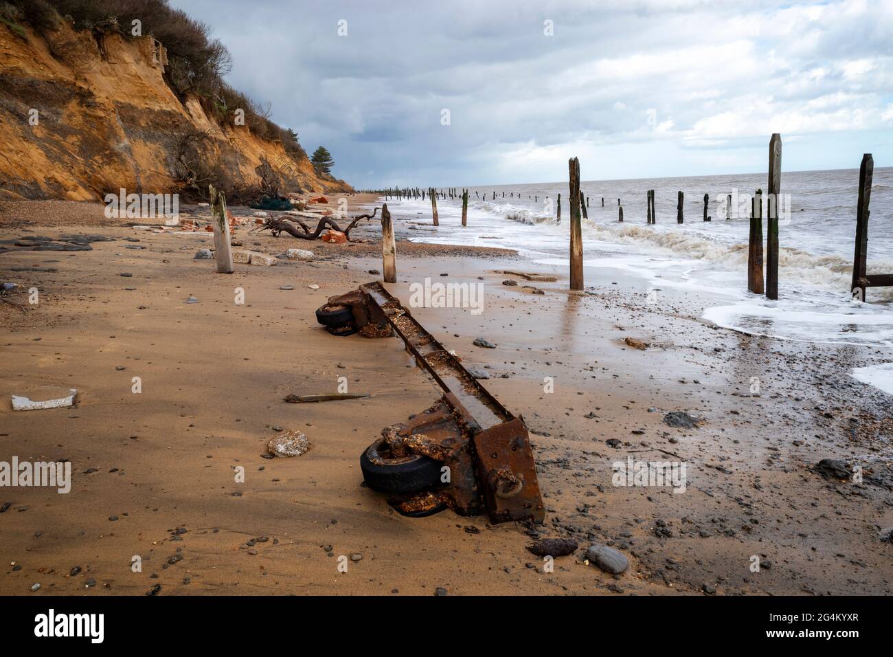 Beach debris cased by coastal erosion Stock Photo - Alamy
