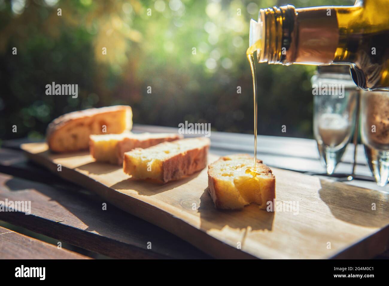 Sicilian olive oil on bread Stock Photo - Alamy