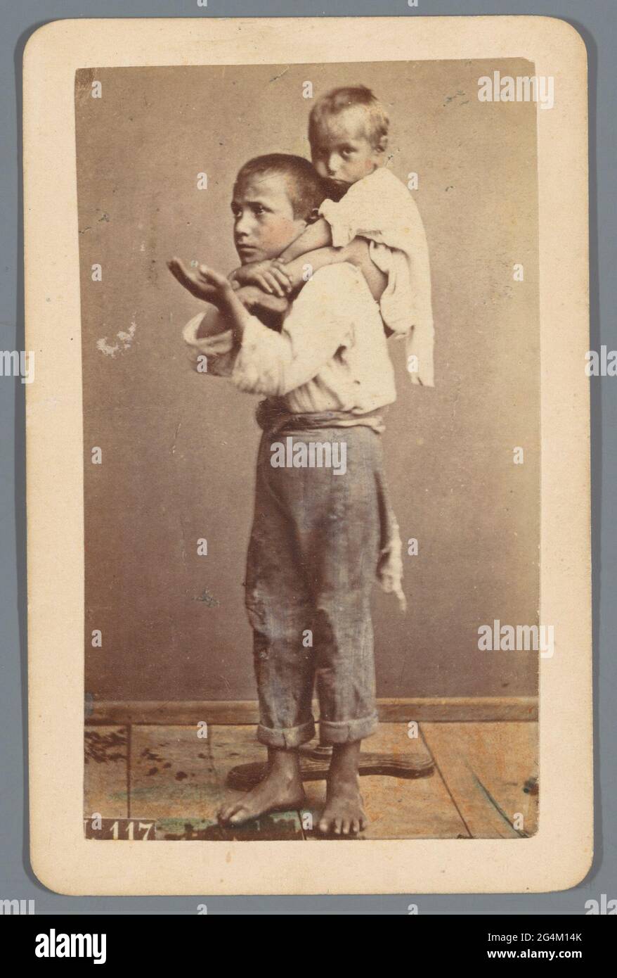 Two young beggars Stock Photo - Alamy