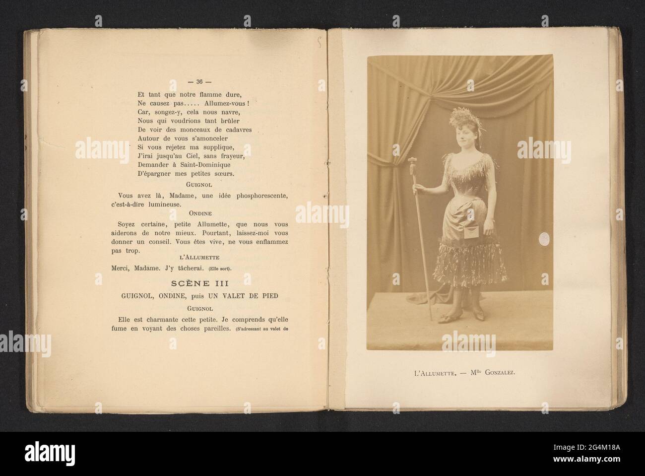 Portrait of Mrs. Gonzalez dressed in a dress with fringes and a stick ...