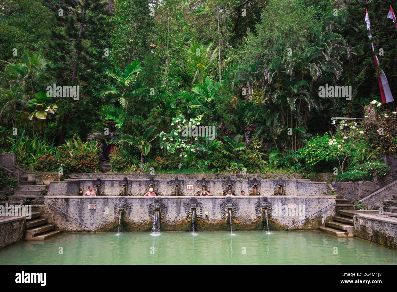 People take a bath in thermal Banjar Tega hot springs, Bali, Indonesia ...
