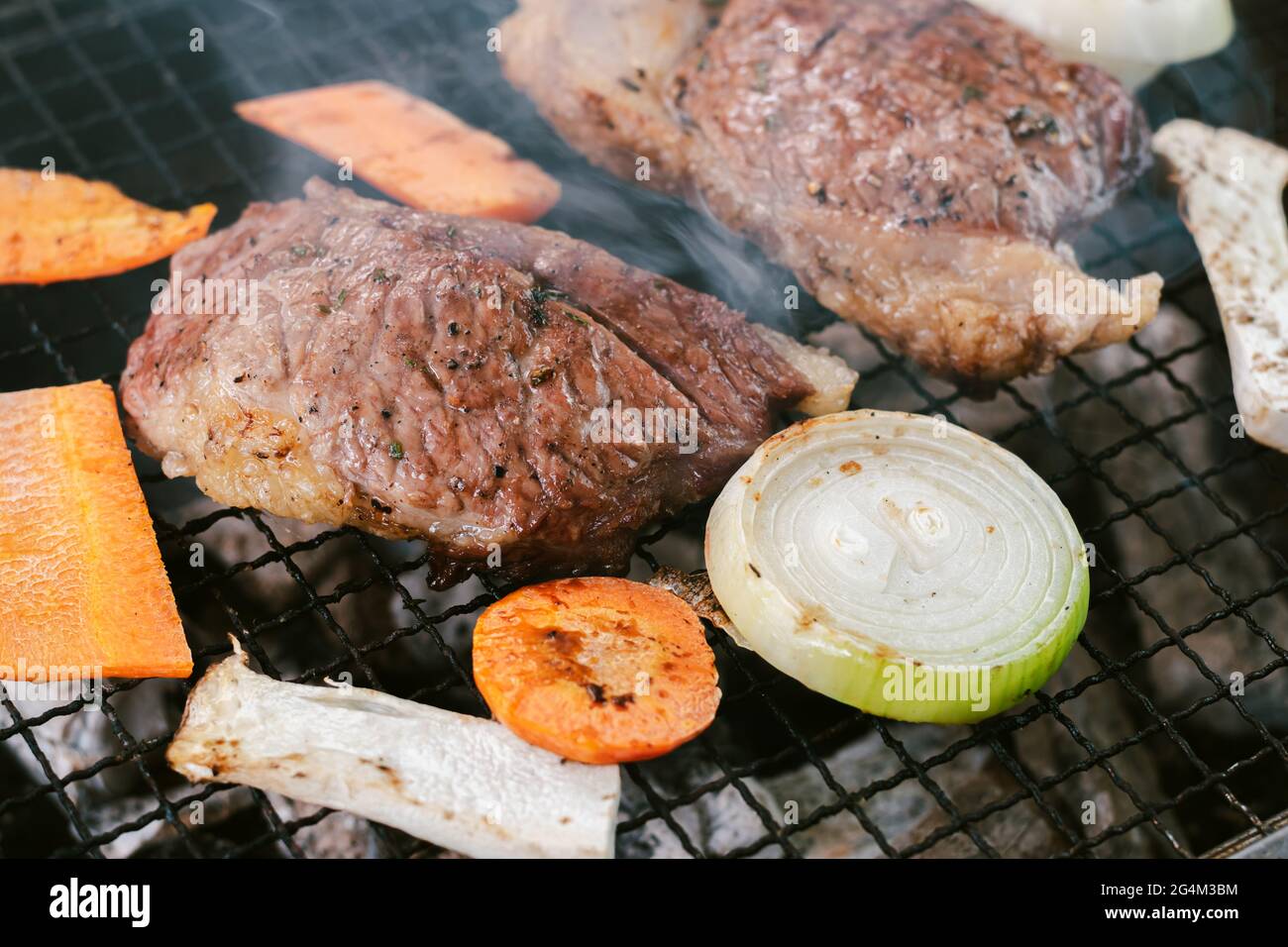 Closeup group of grill the beef on the charcoal grill to cook steaks ...