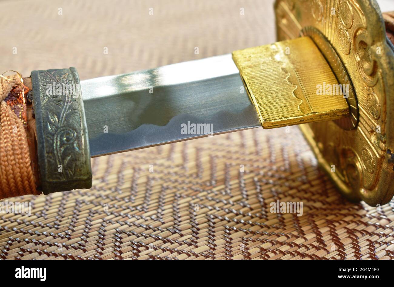 Japanese samurai sword blade or katana on bamboo mat background Stock ...