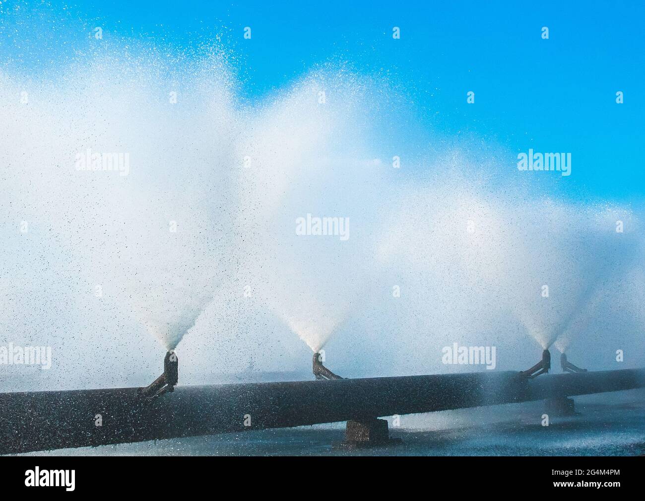Fountains from a system of pipes cooling water at a thermal power plant ...