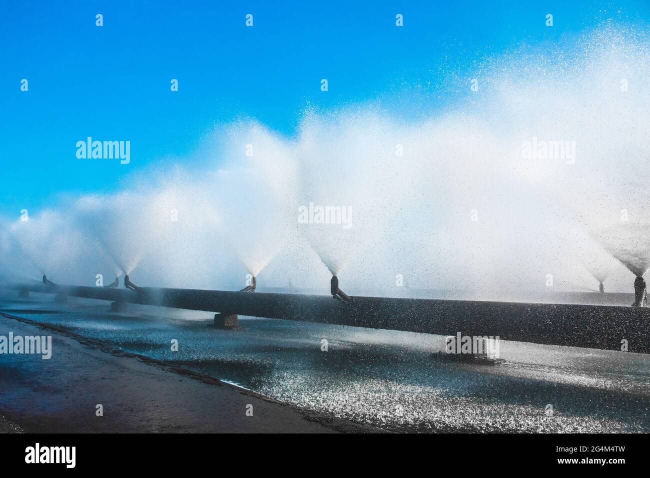 Fountains from a system of pipes cooling water at a thermal power plant ...