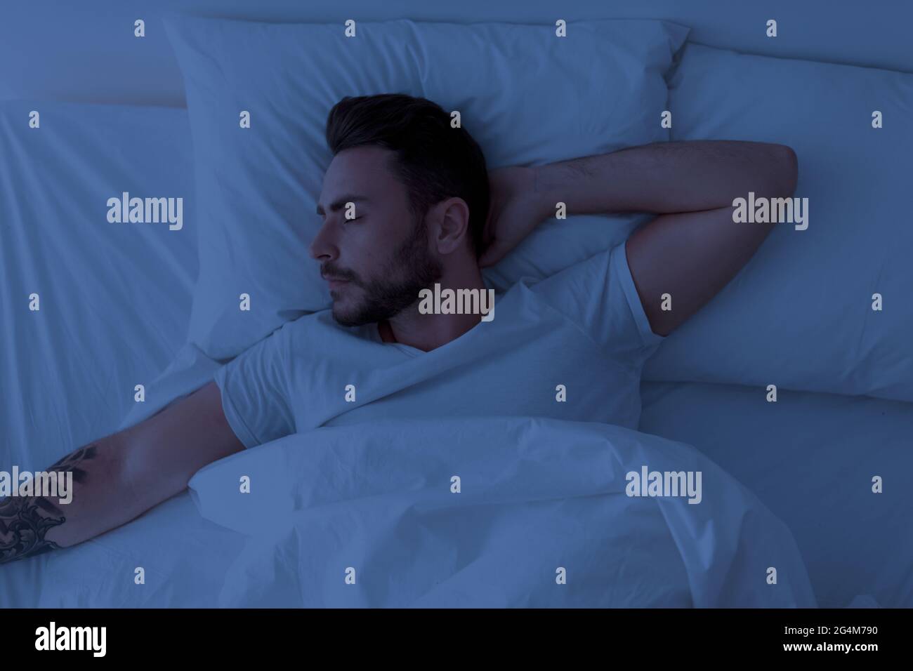 Man lying in bed alone lazy hi-res stock photography and images - Alamy