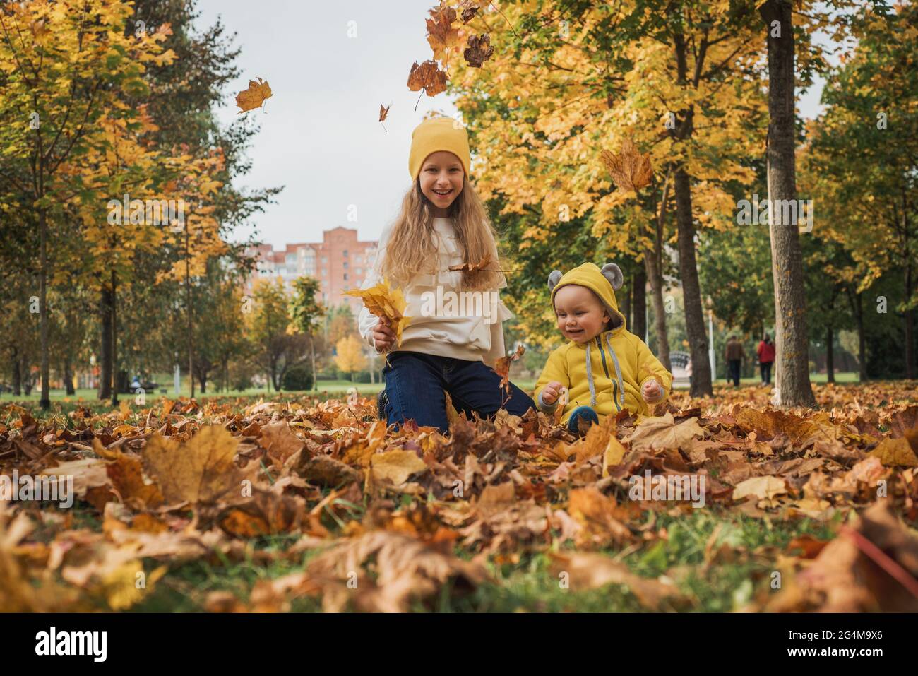 Happy children walk in autumn park. leaf fall, lifestyle Stock Photo ...