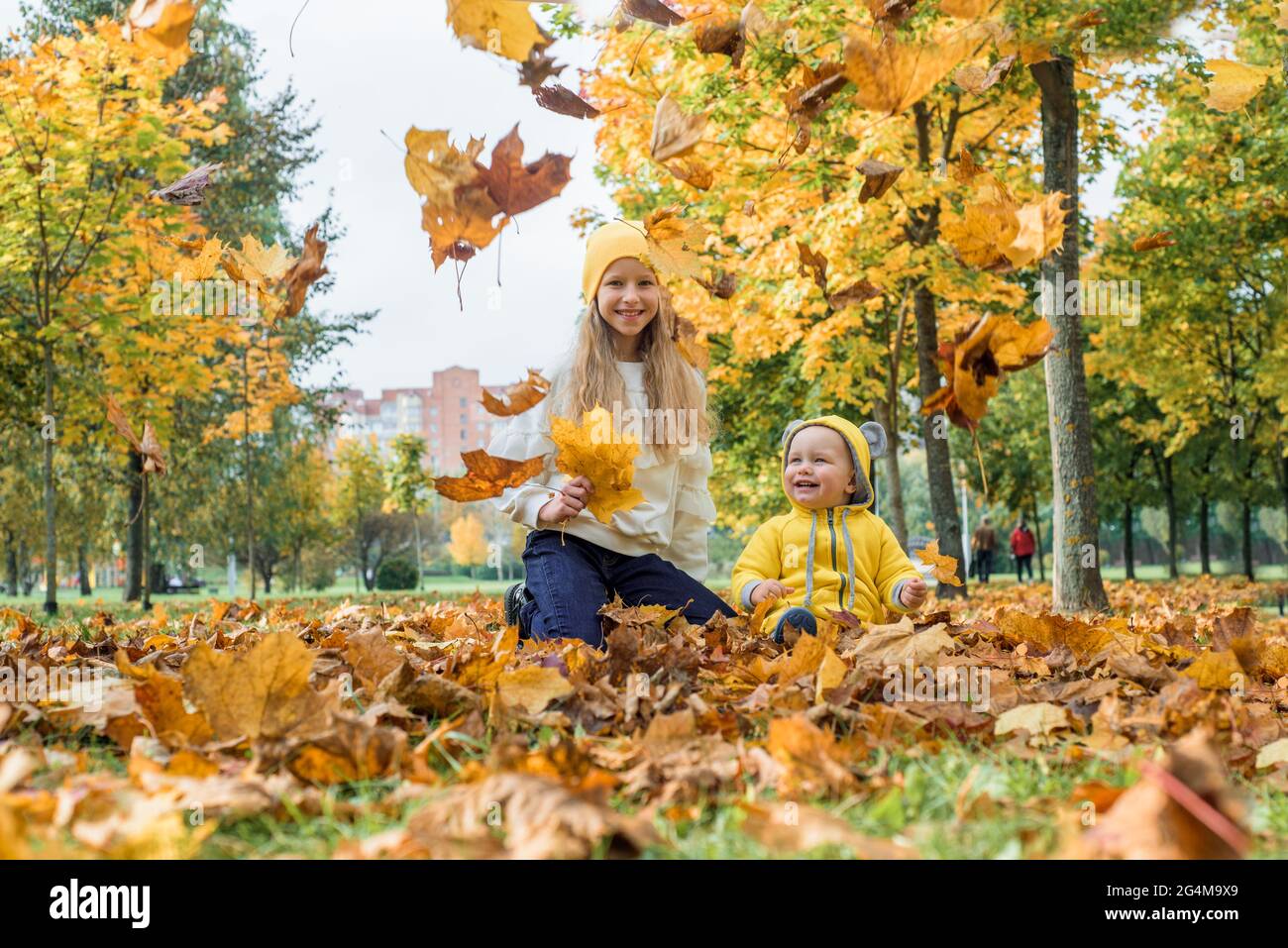 Happy children walk in autumn park. leaf fall, lifestyle Stock Photo ...