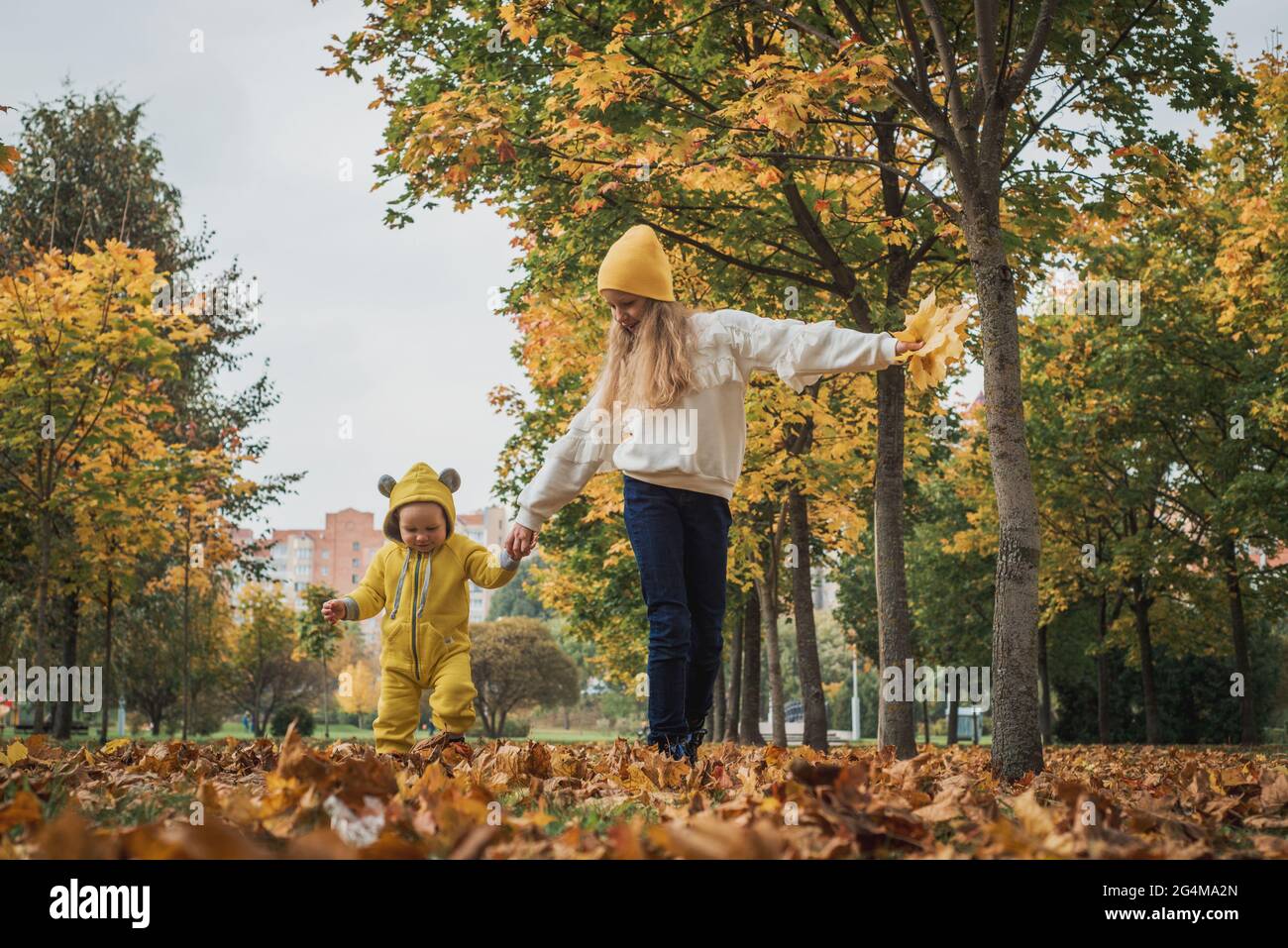 Happy children walk in autumn park. leaf fall, lifestyle Stock Photo ...