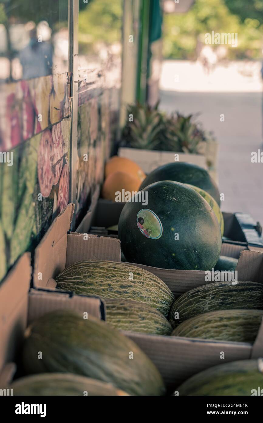 watermelons and melons at a street fruit stall Stock Photo - Alamy