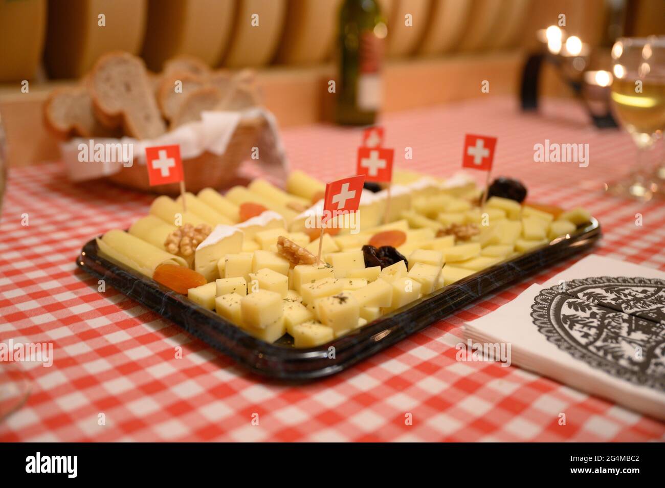 swiss cheese plate with swiss flags as a starter Stock Photo - Alamy