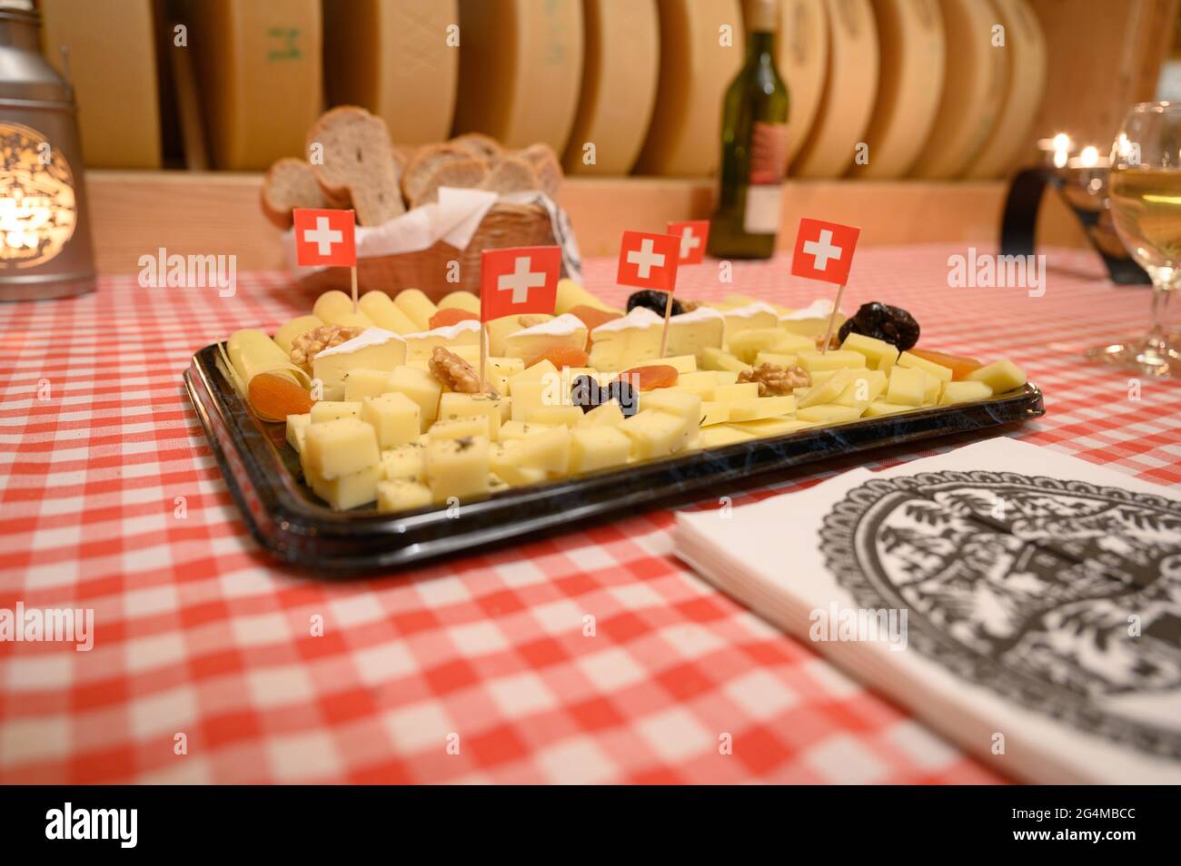 swiss cheese plate with swiss flags as a starter Stock Photo - Alamy